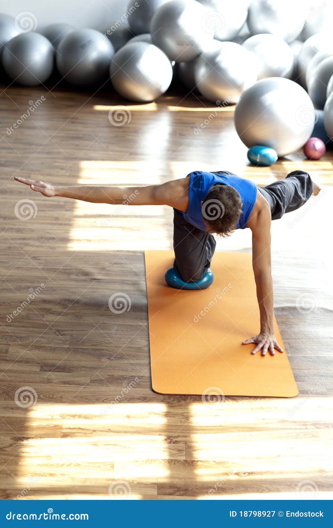 Man practicing pilates stock image. Image of balls, ball - 18798927