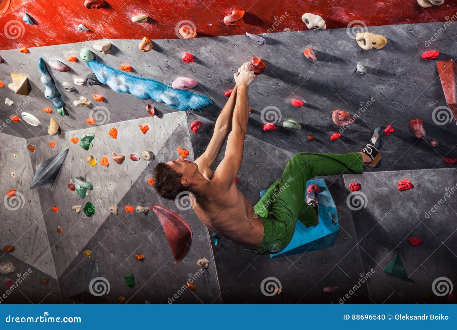 Man Practicing Rock-climbing on a Rock Wall Indoors Stock Photo - Image ...