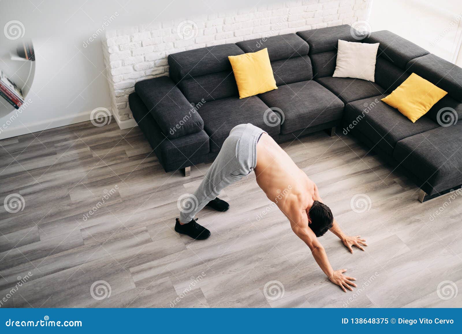 Man Practicing Yoga at Home Doing Sun Salutation Routine Stock Image ...