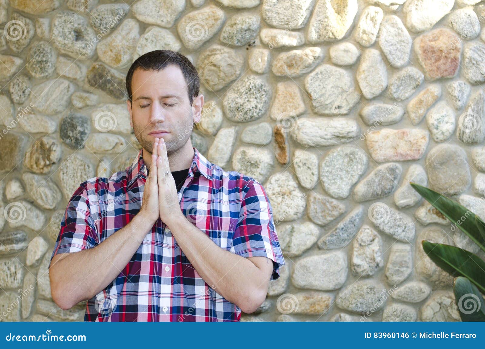 Man praying alone outside. stock photo. Image of hands - 83960146