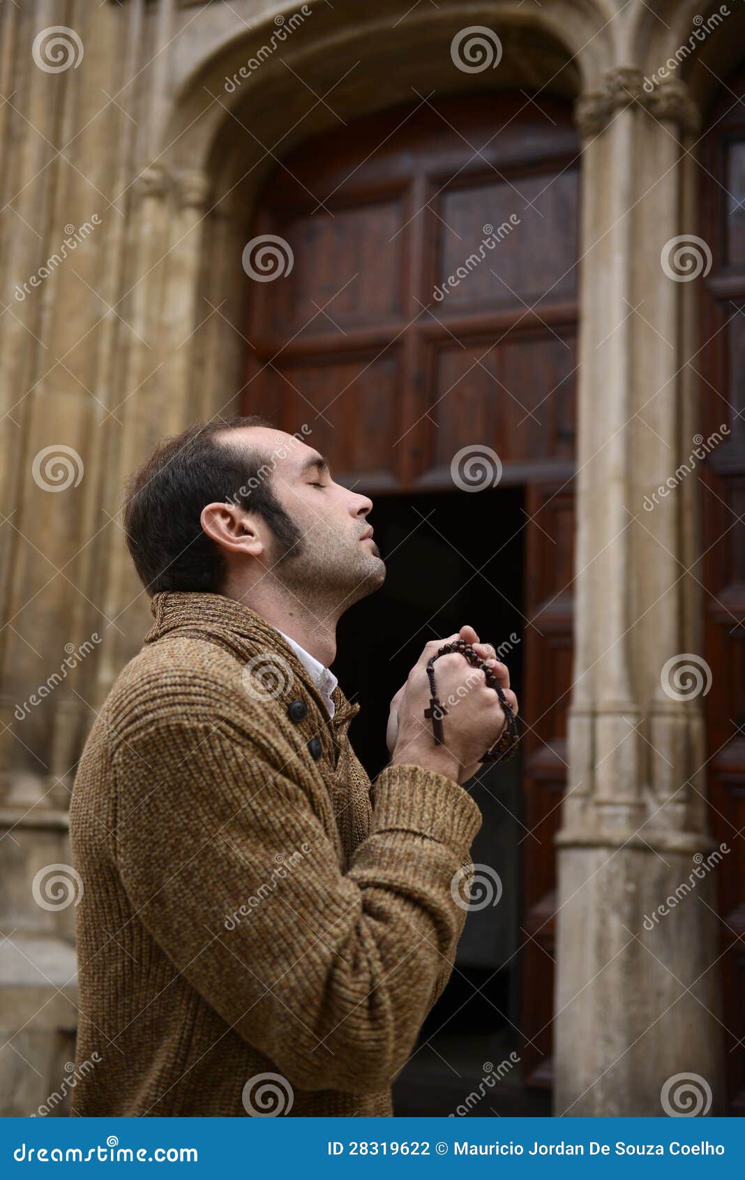 Man Praying in Church Holding Prayer Beads Stock Photo - Image of ...