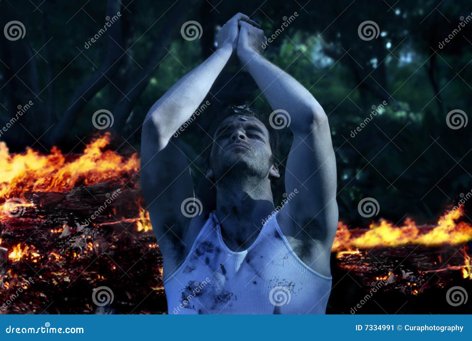 Man Praying with Fire in Background Stock Image - Image of face ...