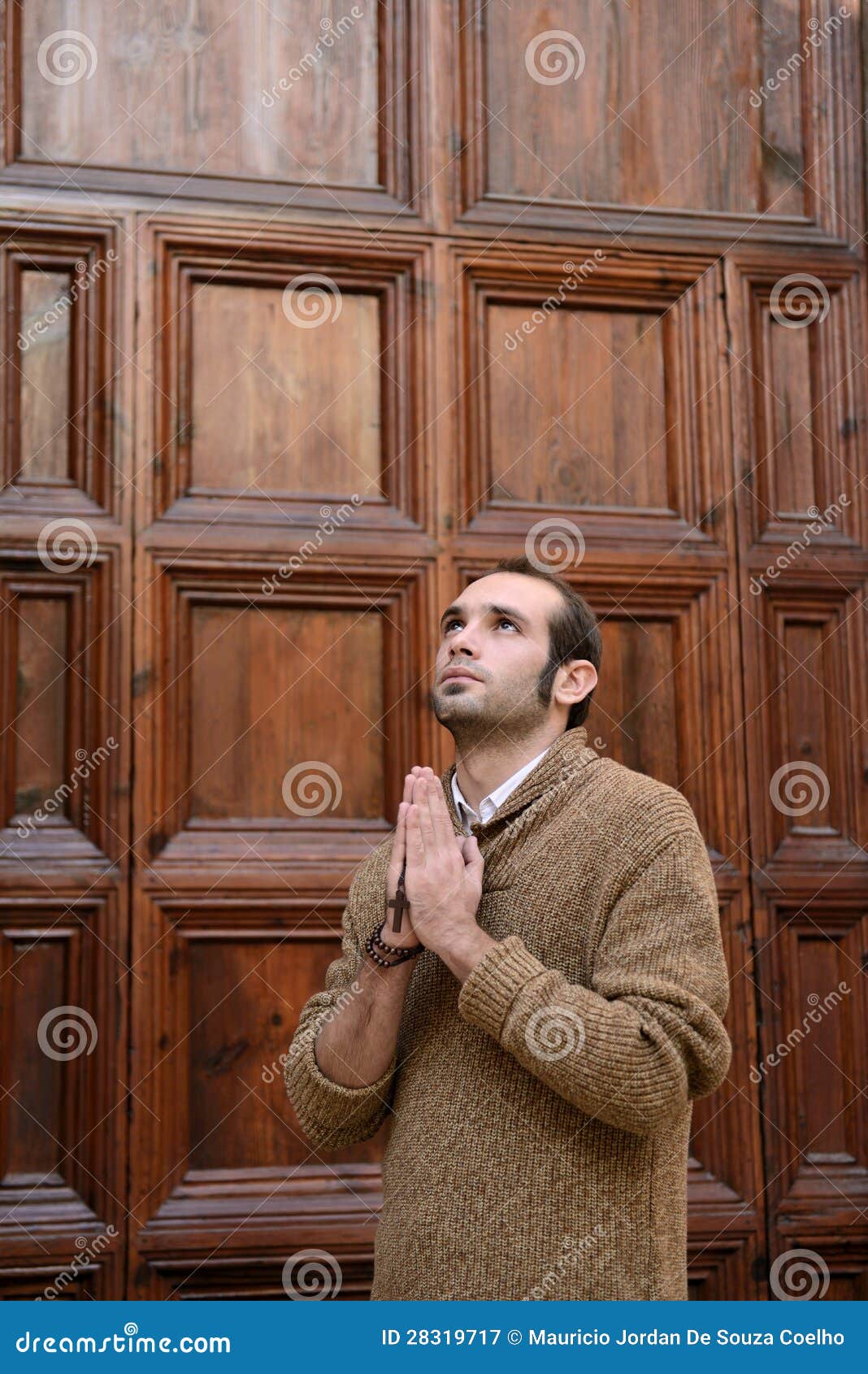 Man Praying in Front of the Church Holding Prayer Beads Stock Image ...