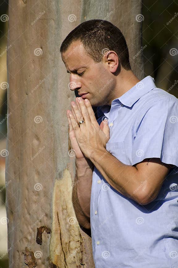 Man praying outside. stock image. Image of hand, concentrating - 74749551