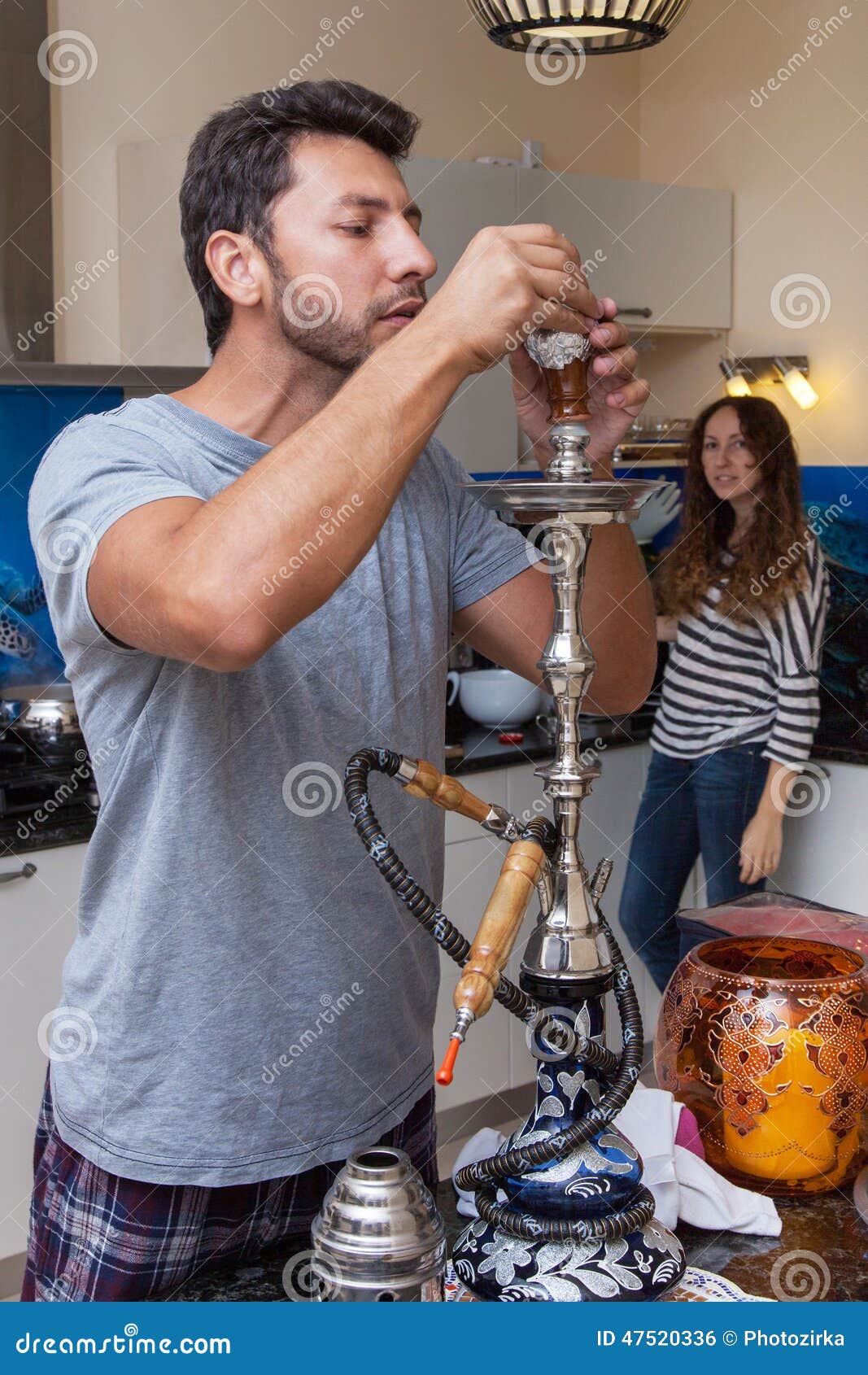 Man prepares a hookah stock photo. Image of male, hukka - 47520336