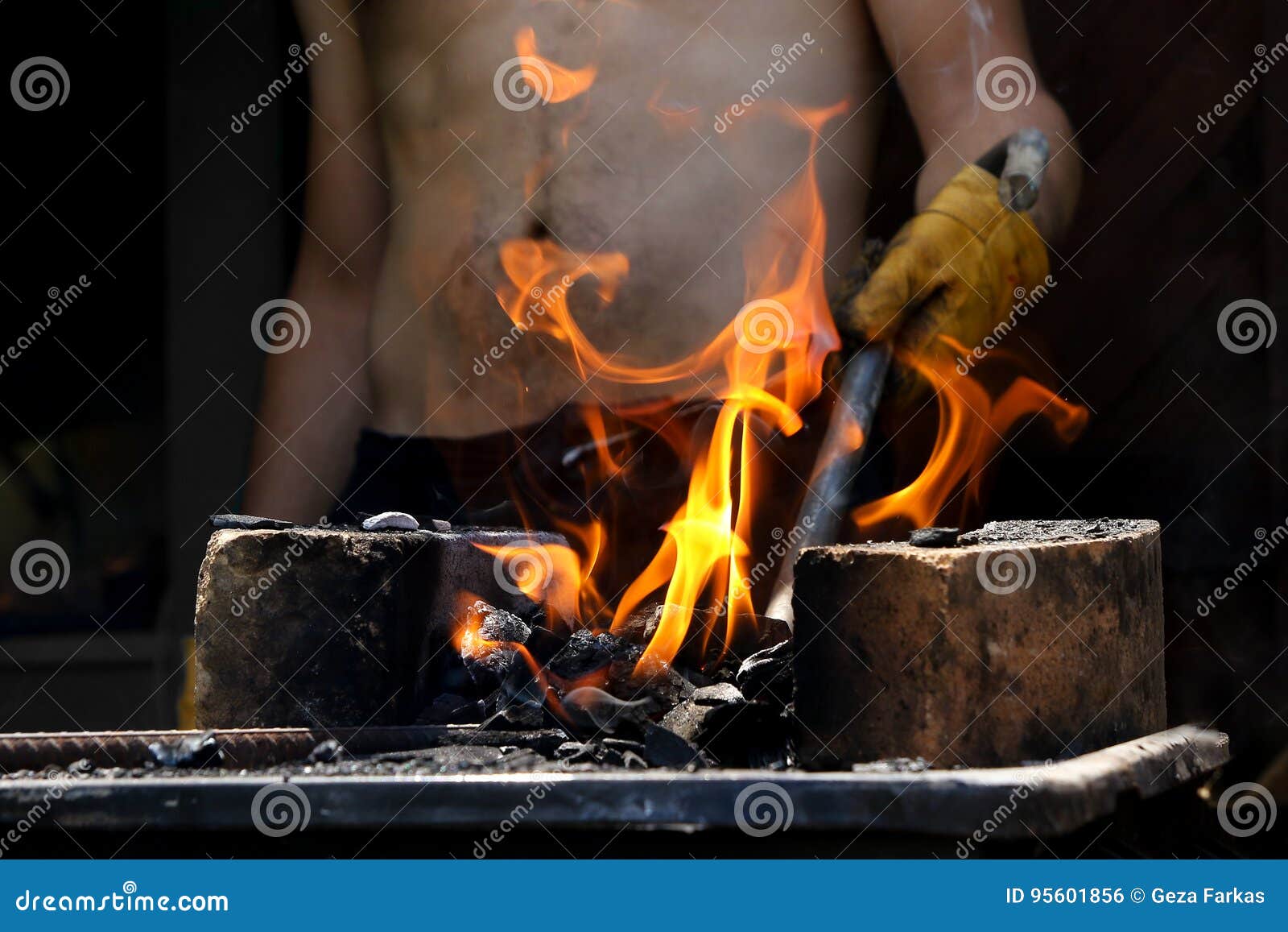 Man Preparing a Fire with Coal for Barbecue Stock Photo - Image of ...