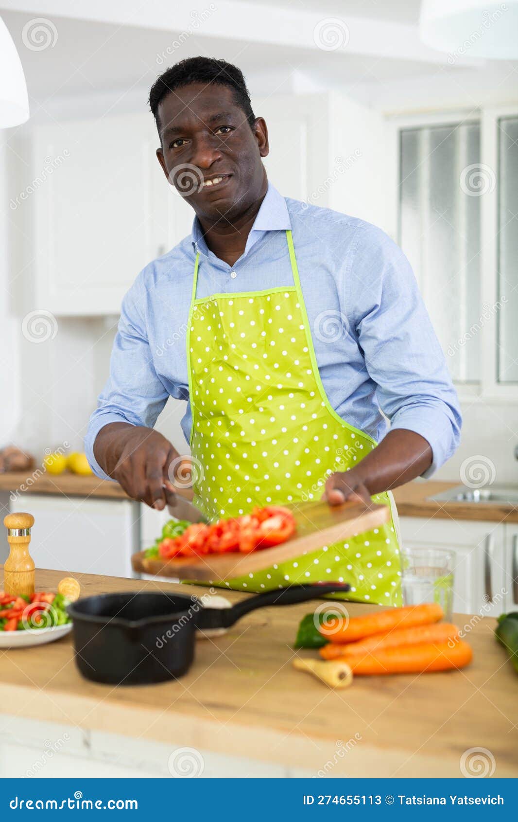 Man preparing food at home stock image. Image of adult - 274655113