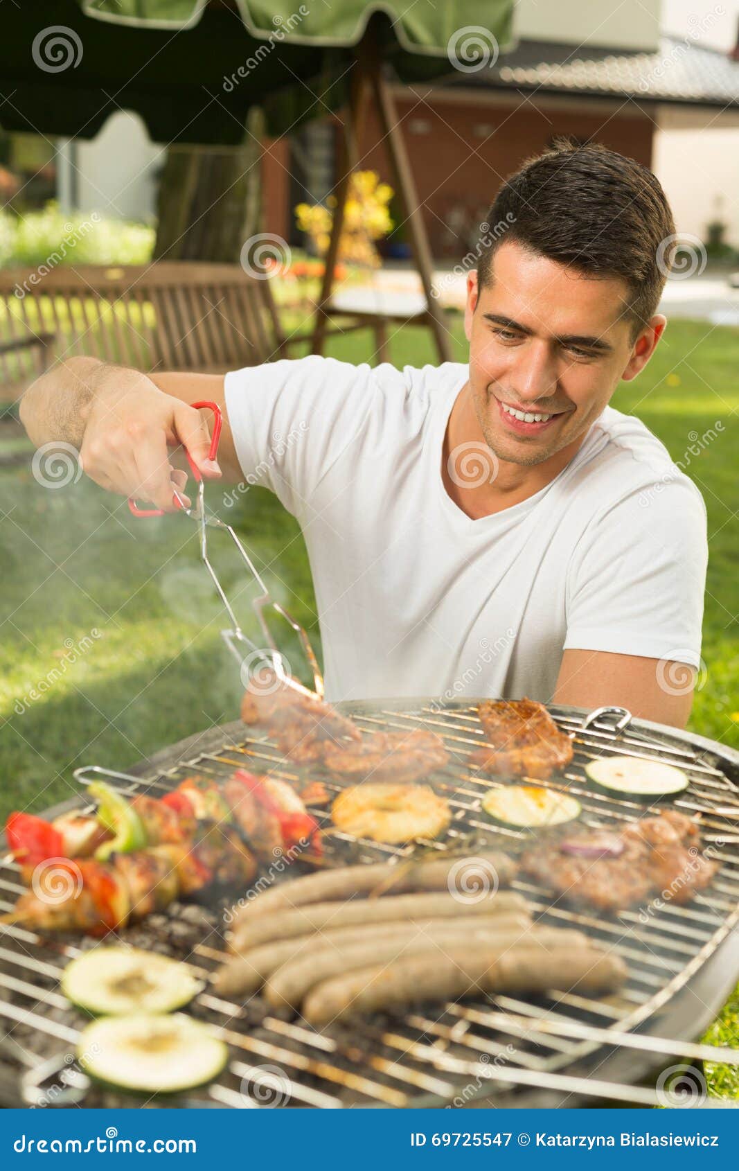 Man Preparing Grill for Friends Stock Image - Image of party, bratwurst ...