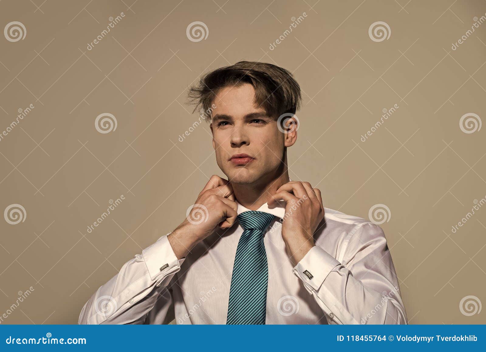 Man Preparing for an Interview. Businessman Tie Necktie on Grey ... Man Preparing for an Interview. Businessman Tie Necktie on Grey ...