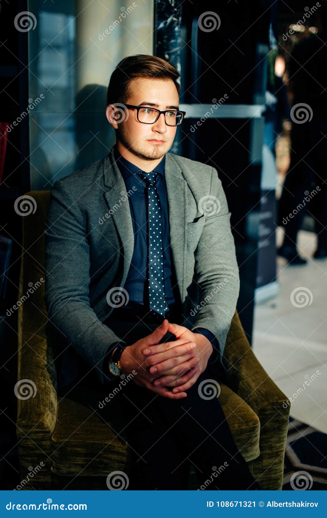 Man is Preparing for Interview. he in Suit, Sitting in Hall on Chair ... Man is Preparing for Interview. he in Suit, Sitting in Hall on Chair ...