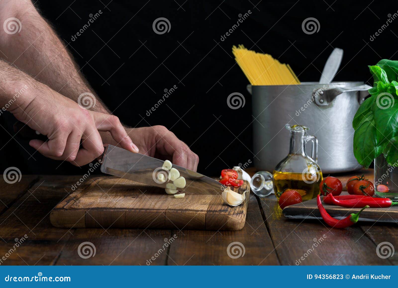 Man Preparing an Italian Pasta on a Wooden Table Stock Image - Image of ...