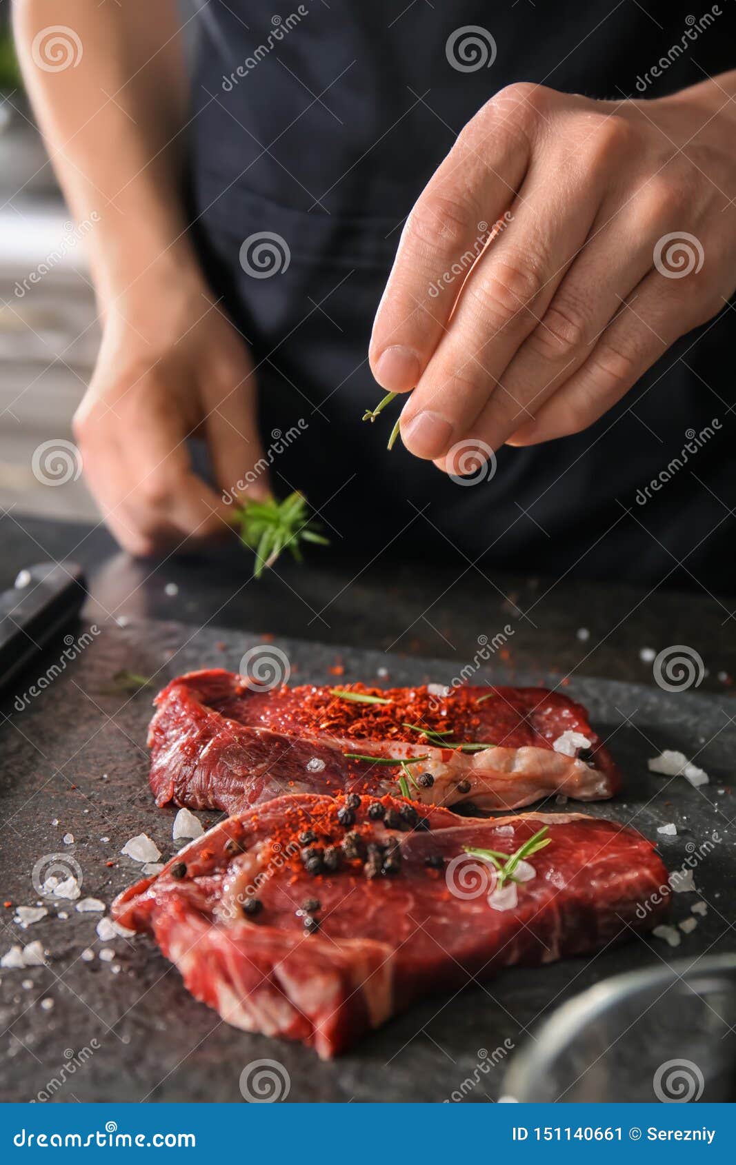 Man Preparing Meat in Kitchen Stock Image - Image of background, herbs ...
