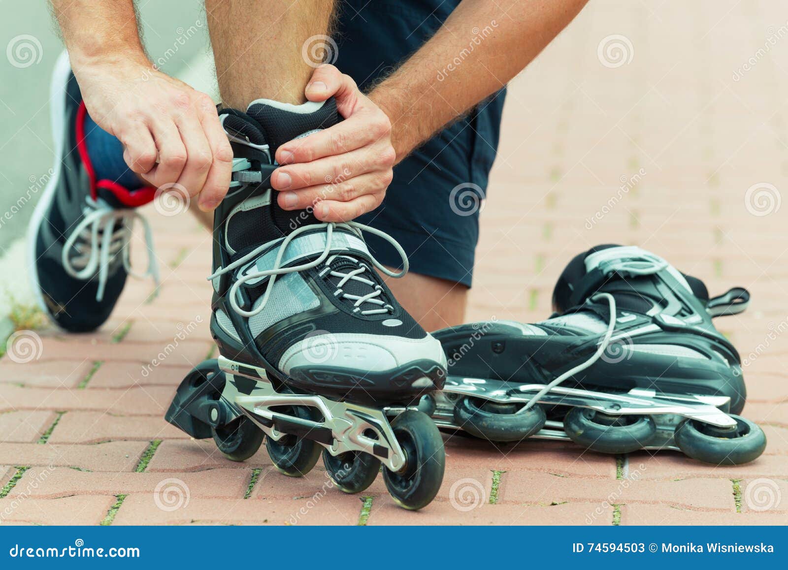 Man Preparing for Roller Blading, Stock Image - Image of right ...