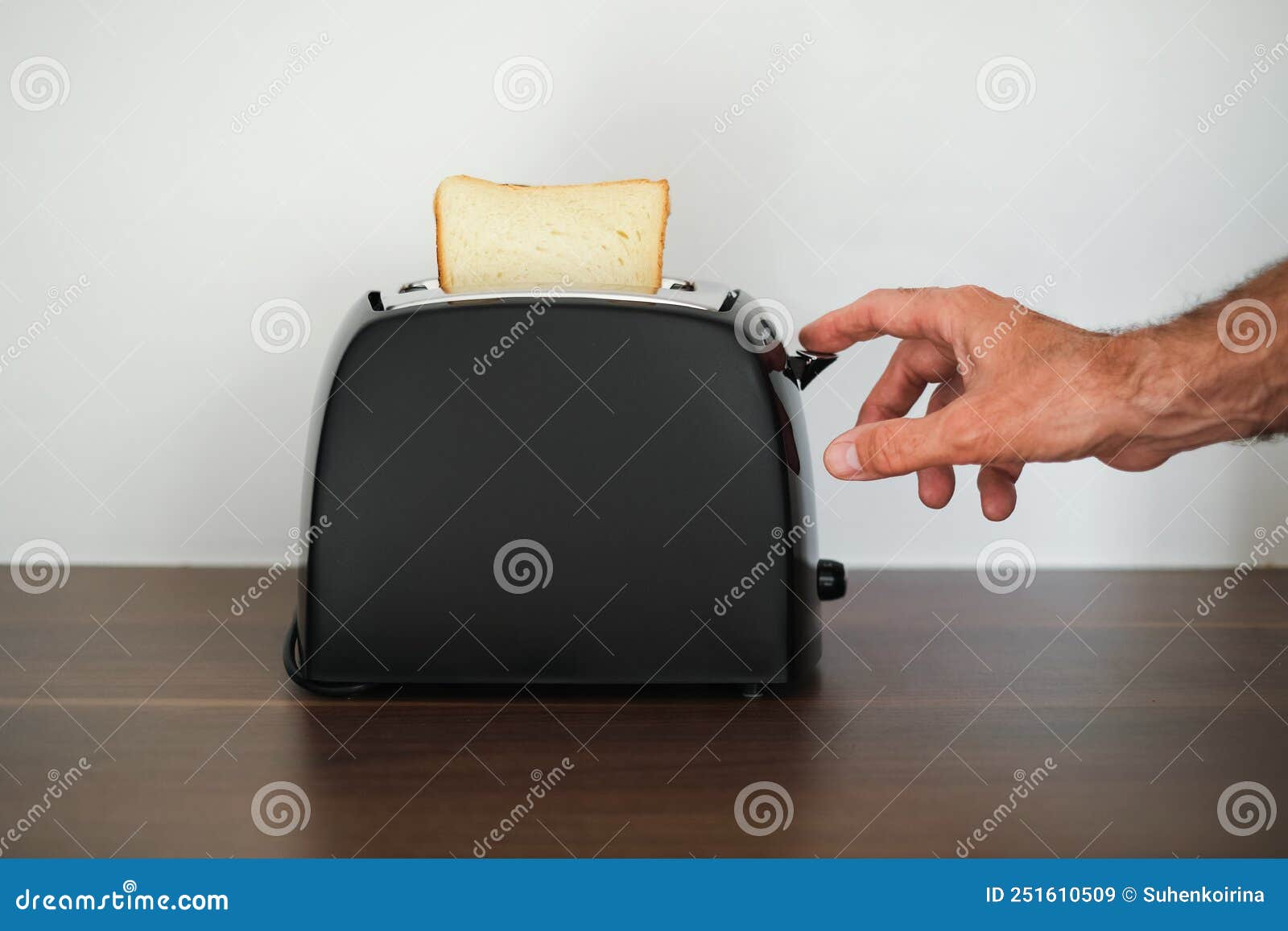 Man Preparing Toast for Breakfast in a Toaster Stock Image - Image of ...