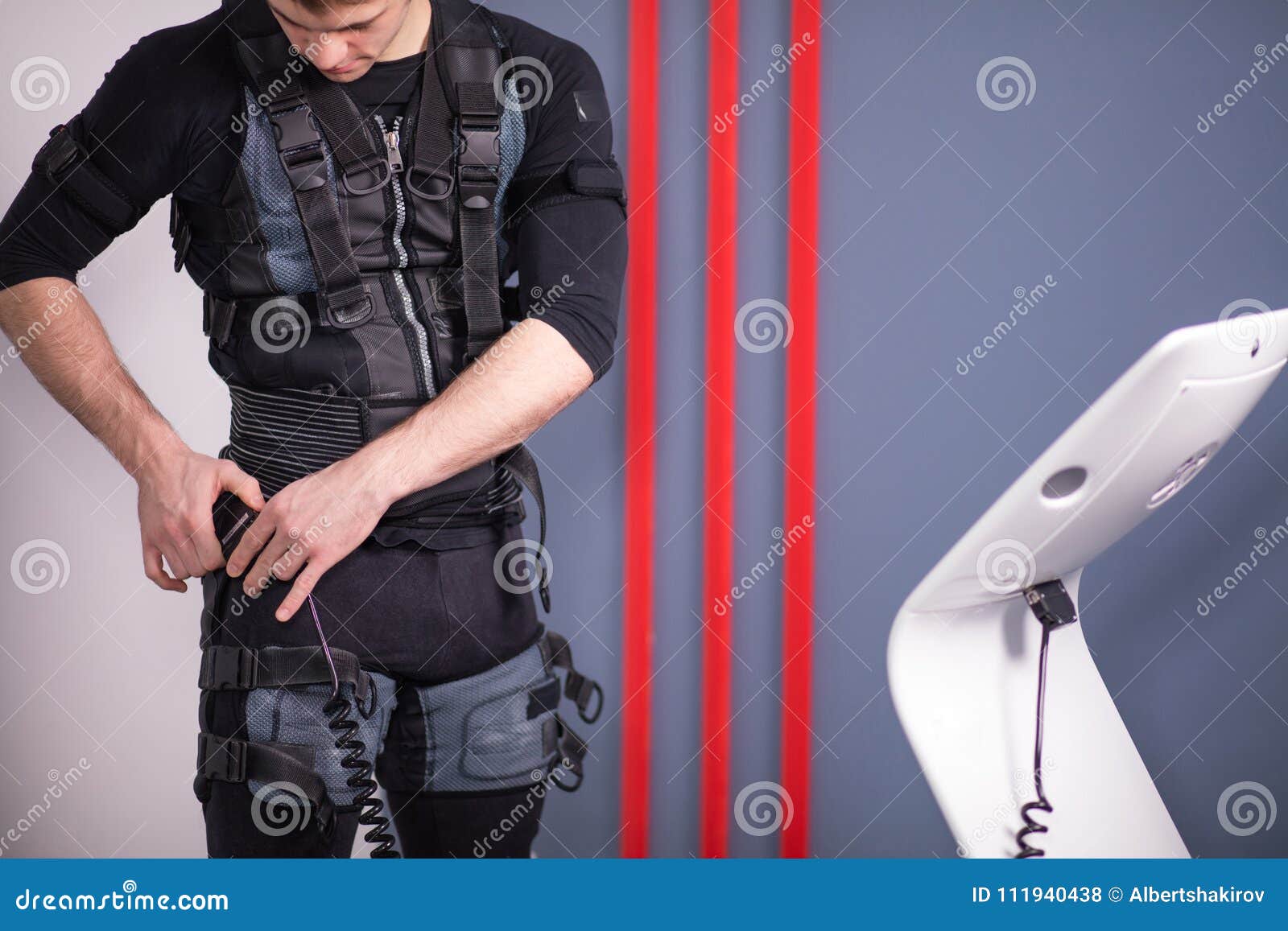 Man Preparing for Training and Connecting Cables of Ems Suit Stock ...