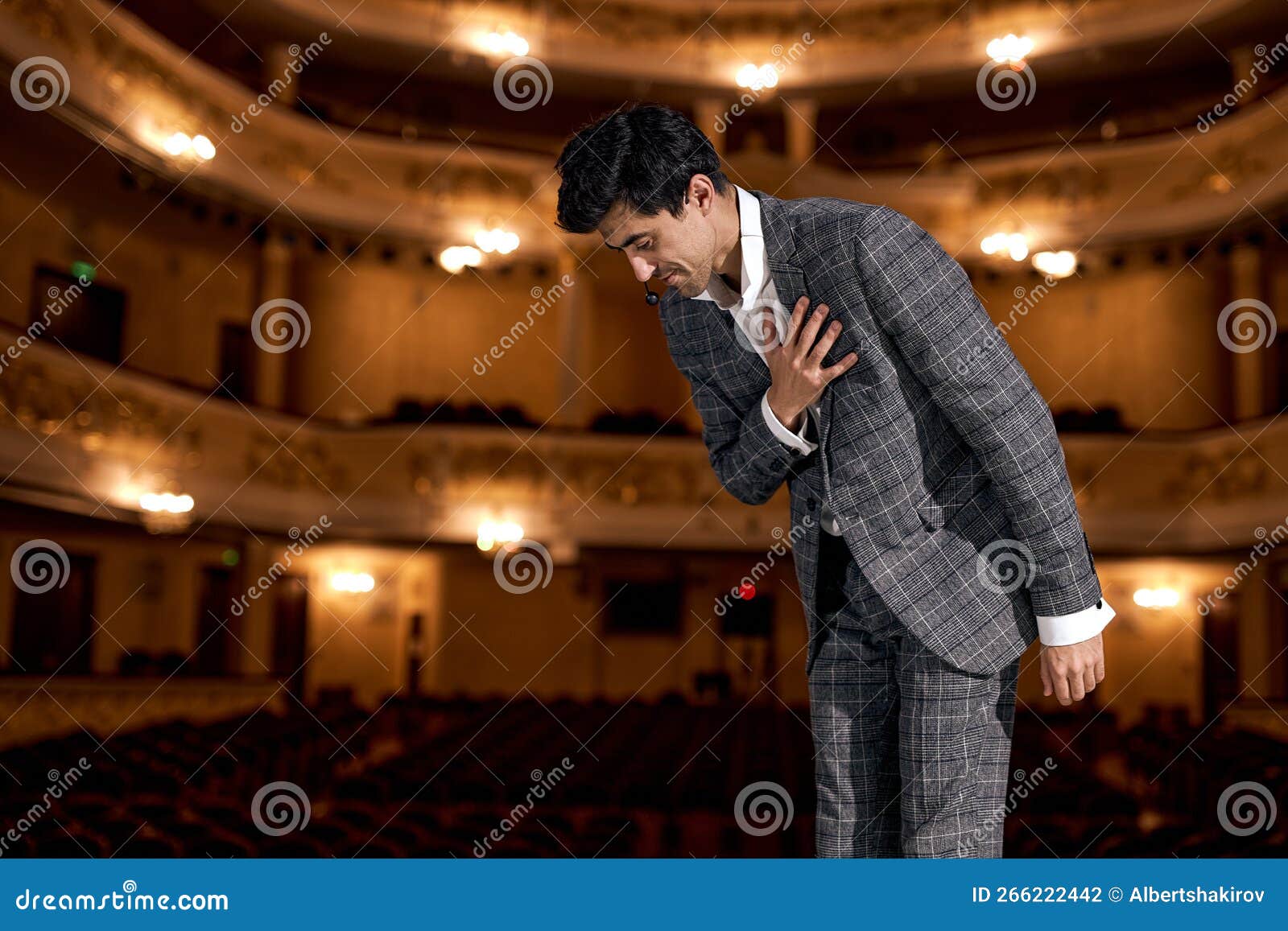 Man Presenter on Stage is Expression Gratitude To Audience after ...