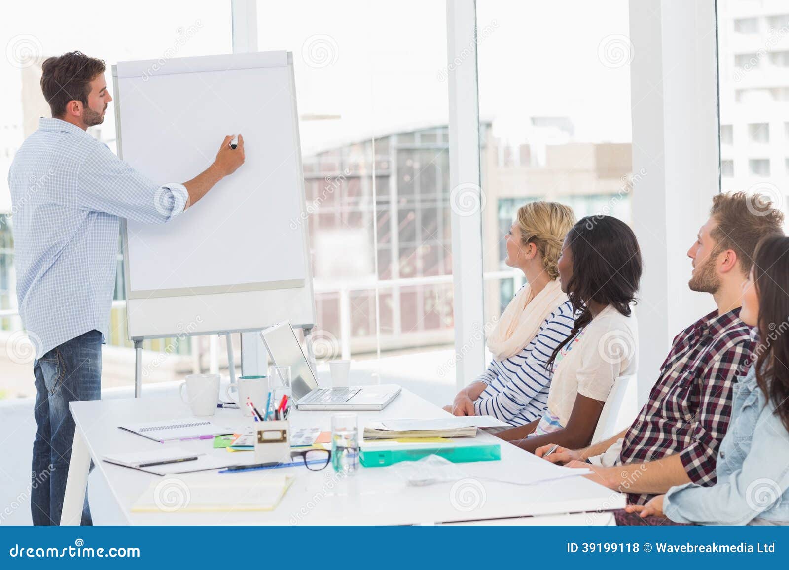 Man Presenting an Idea To His Co Workers Stock Photo - Image of ...