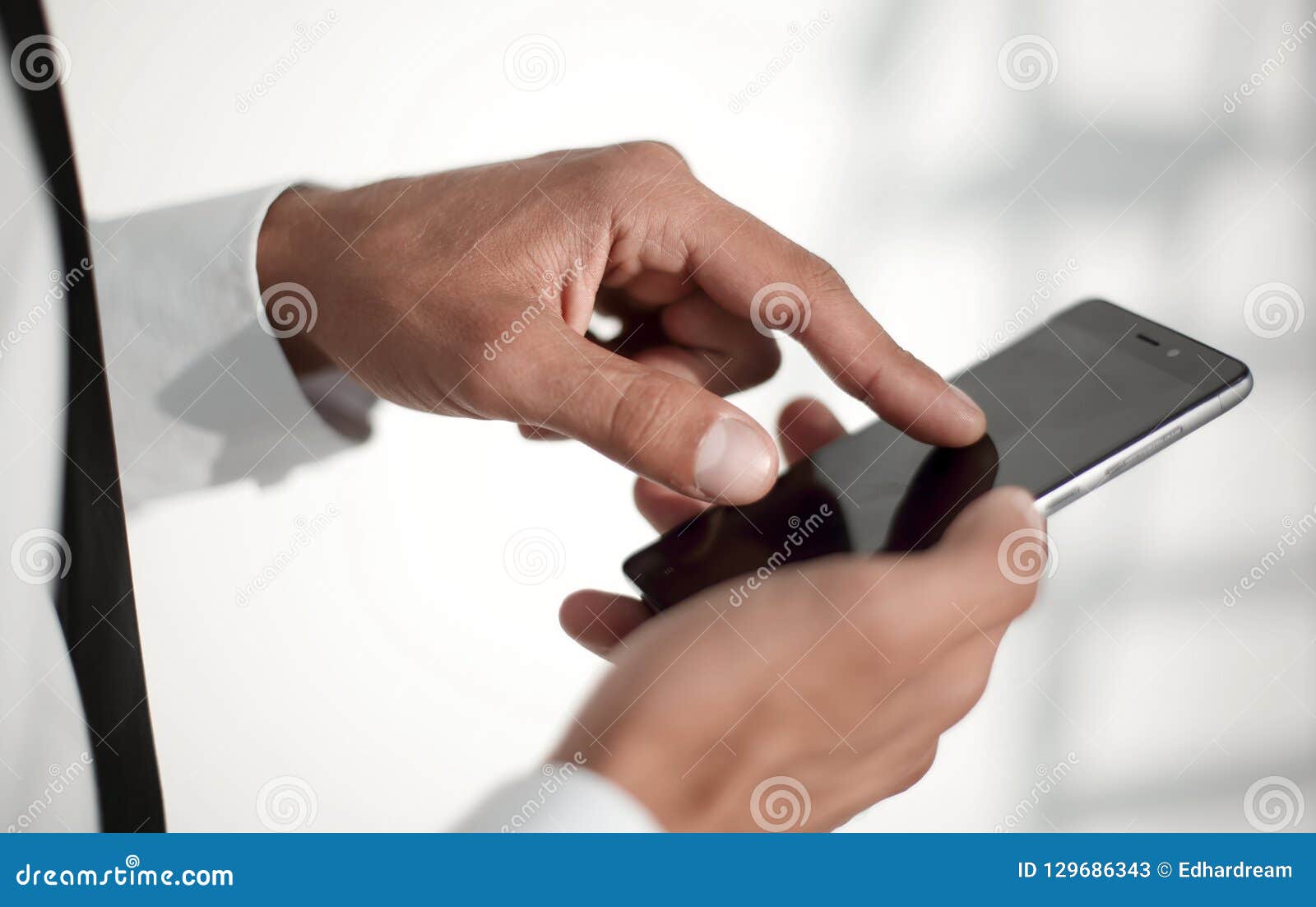 Phone close-up in hands stock image. Image of business - 129686343