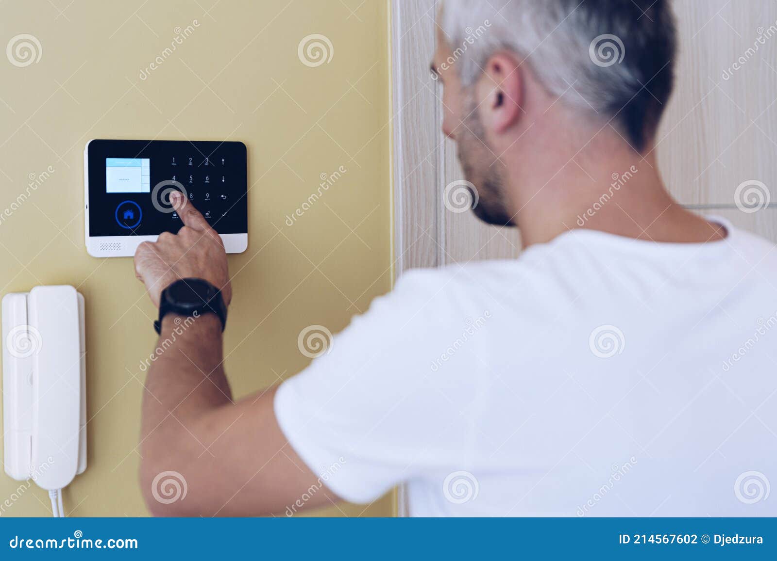 Man Pressing Buttons on Control Panel for Disarming Smart Home System ...