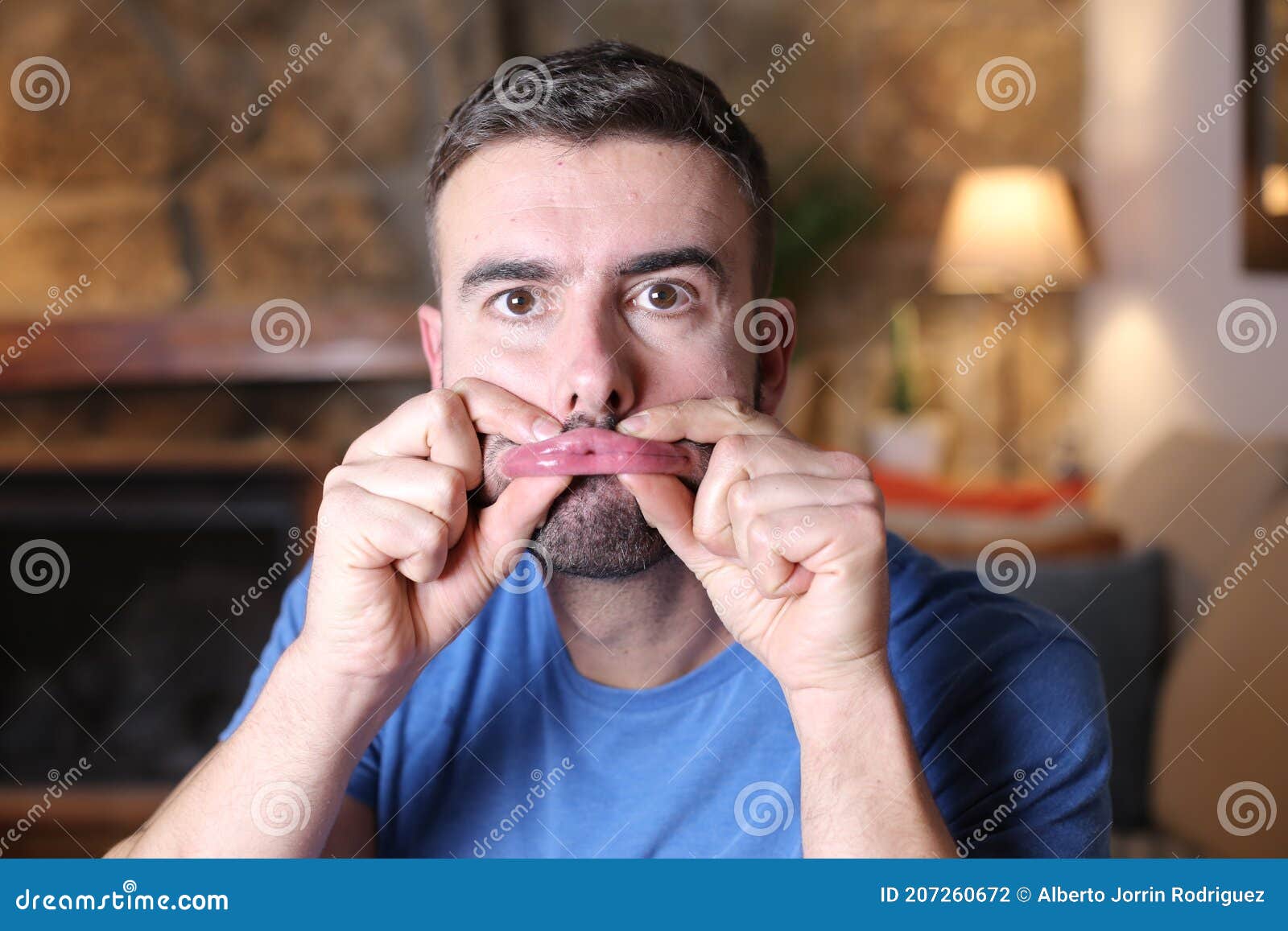 Man Pressing Lips with Fingers Stock Photo - Image of blow, fingers ...