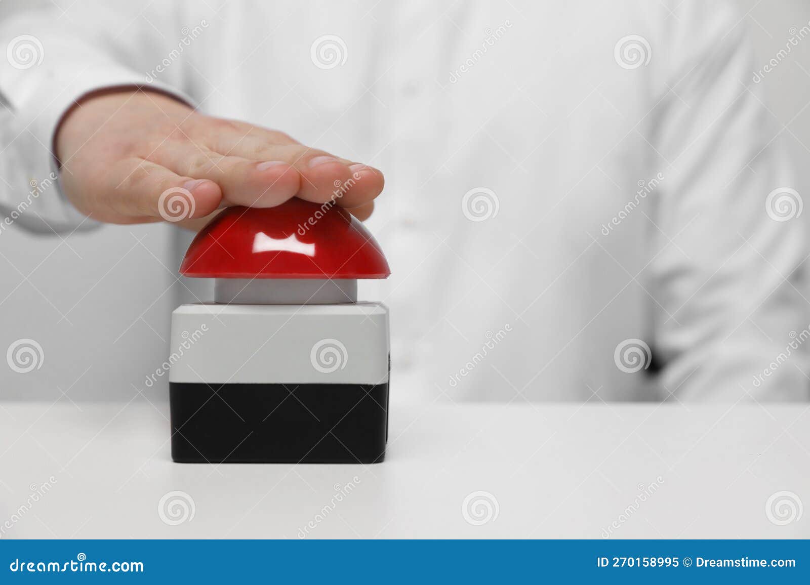 Man Pressing Red Button of Nuclear Weapon at White Table, Closeup with ...