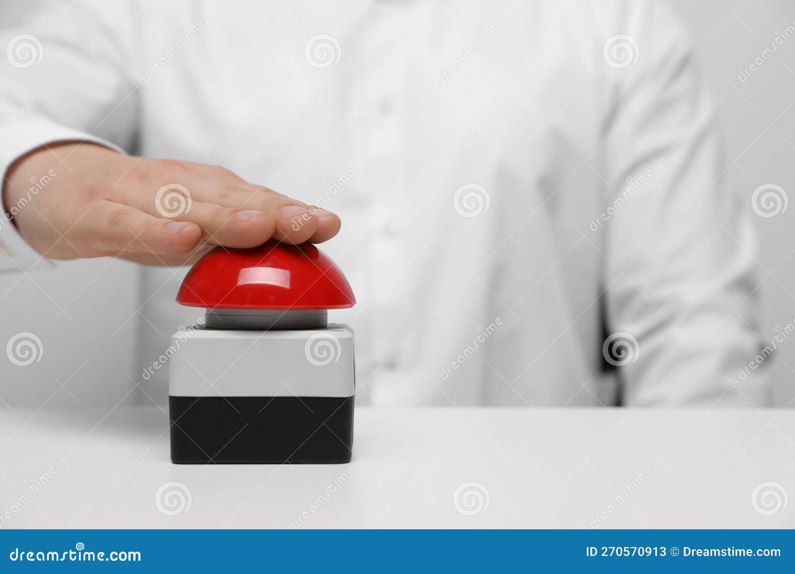 Man Pressing Red Button of Nuclear Weapon at White Table, Closeup with ...