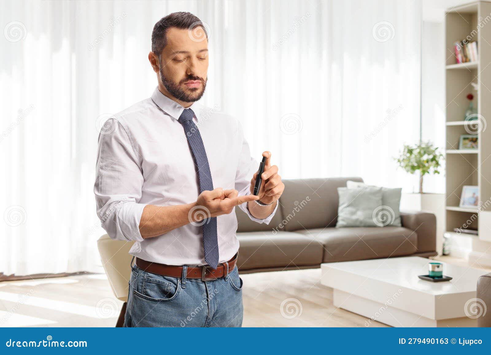 Man Pricking Finger with a Medical Device at Home Stock Image - Image ...