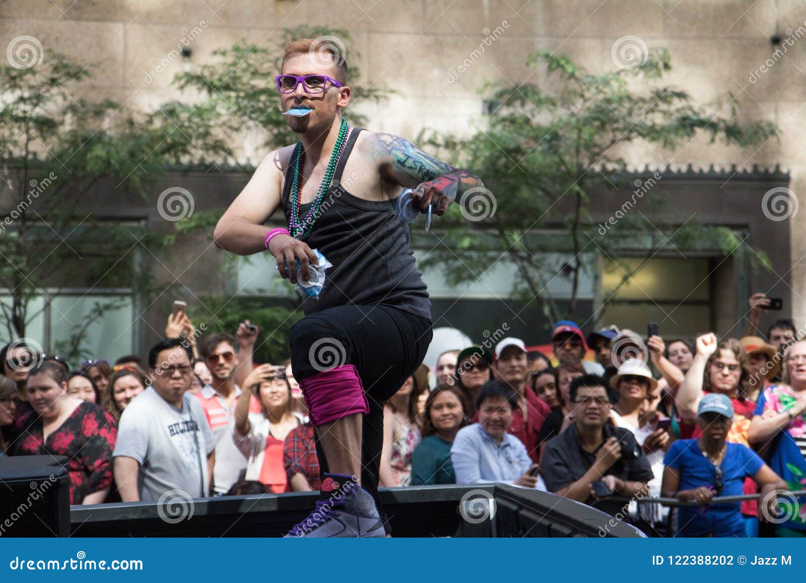 Man at pride throwing pins editorial photography. Image of giving ...