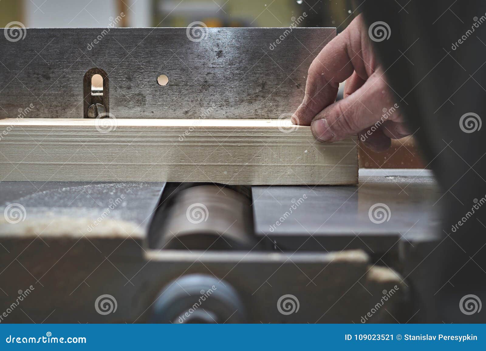 The Man Processes Bar from a Light Tree on the Jointer Plane Stock ...