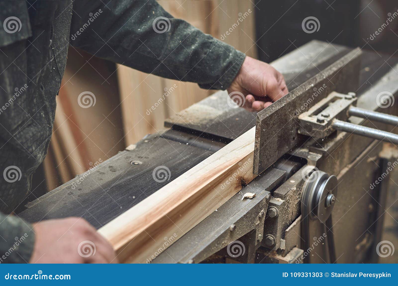 The Man Processes Bar from a Light Tree on the Jointer Plane Stock ...