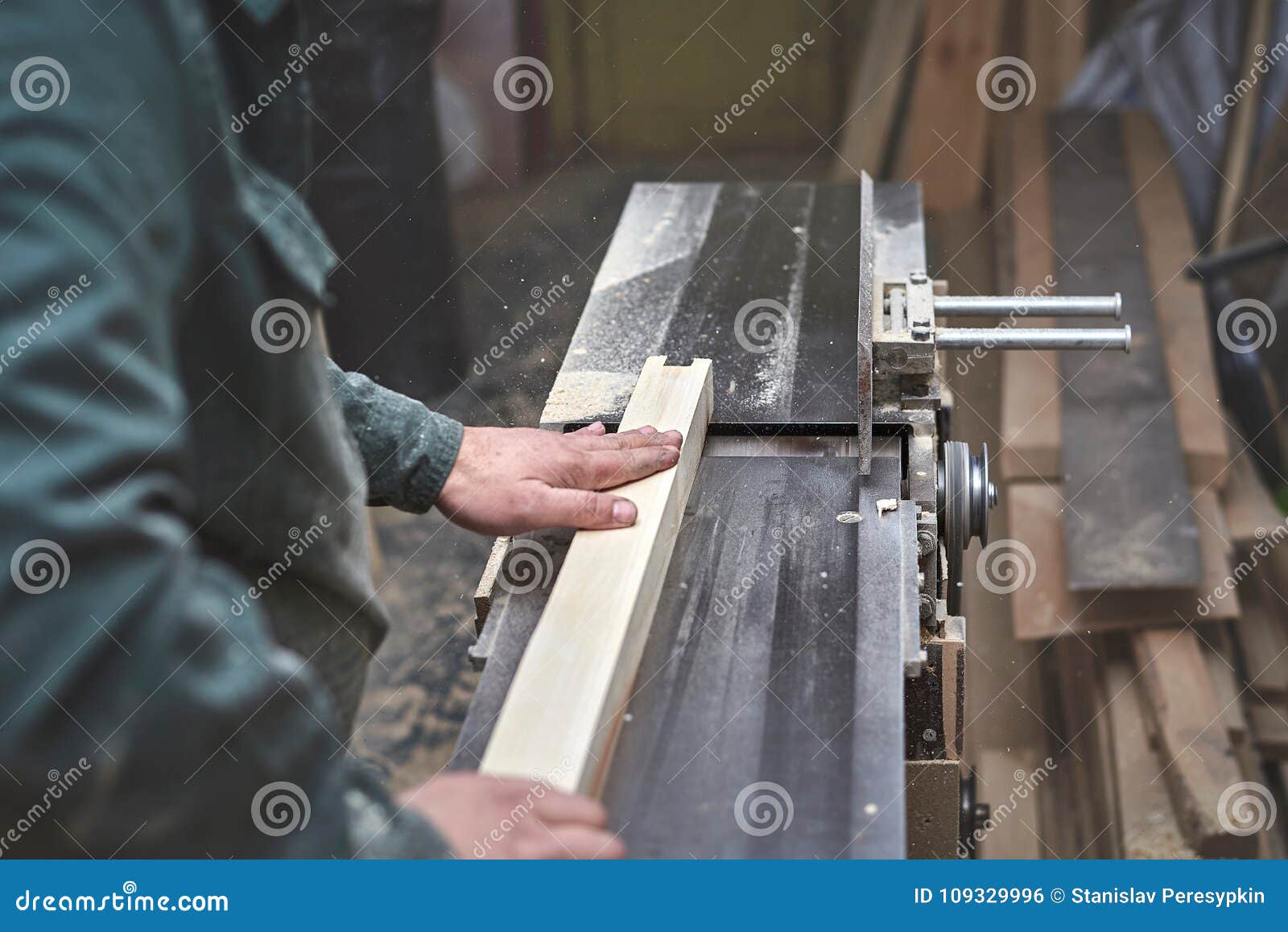 The Man Processes Bar from a Light Tree on the Jointer Plane Stock ...
