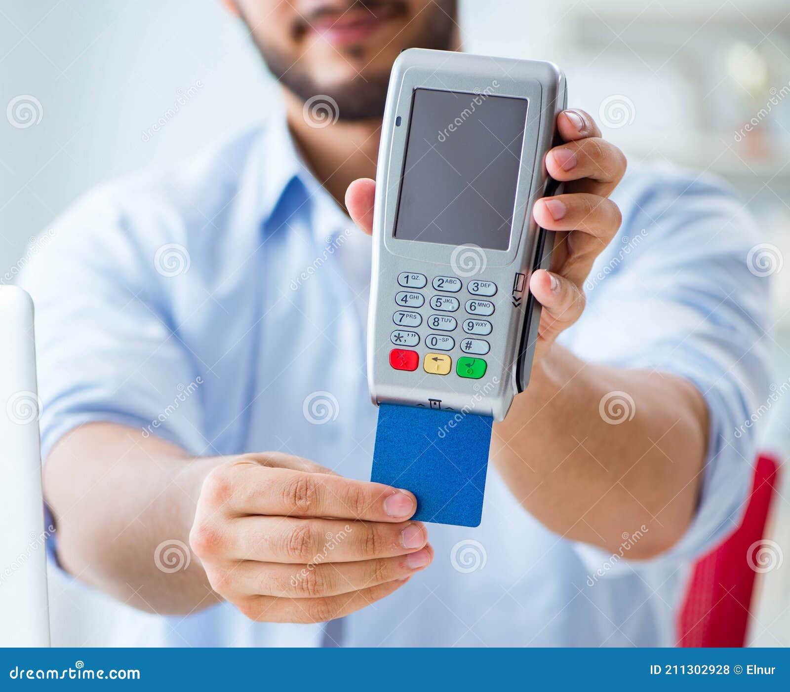 Man Processing Credit Card Transaction with POS Terminal Stock Photo ...