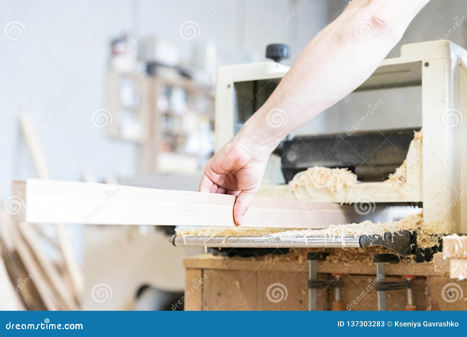 A Man is Processing a Tree. Joiner. a Carpenter. Woodworking Processes ...