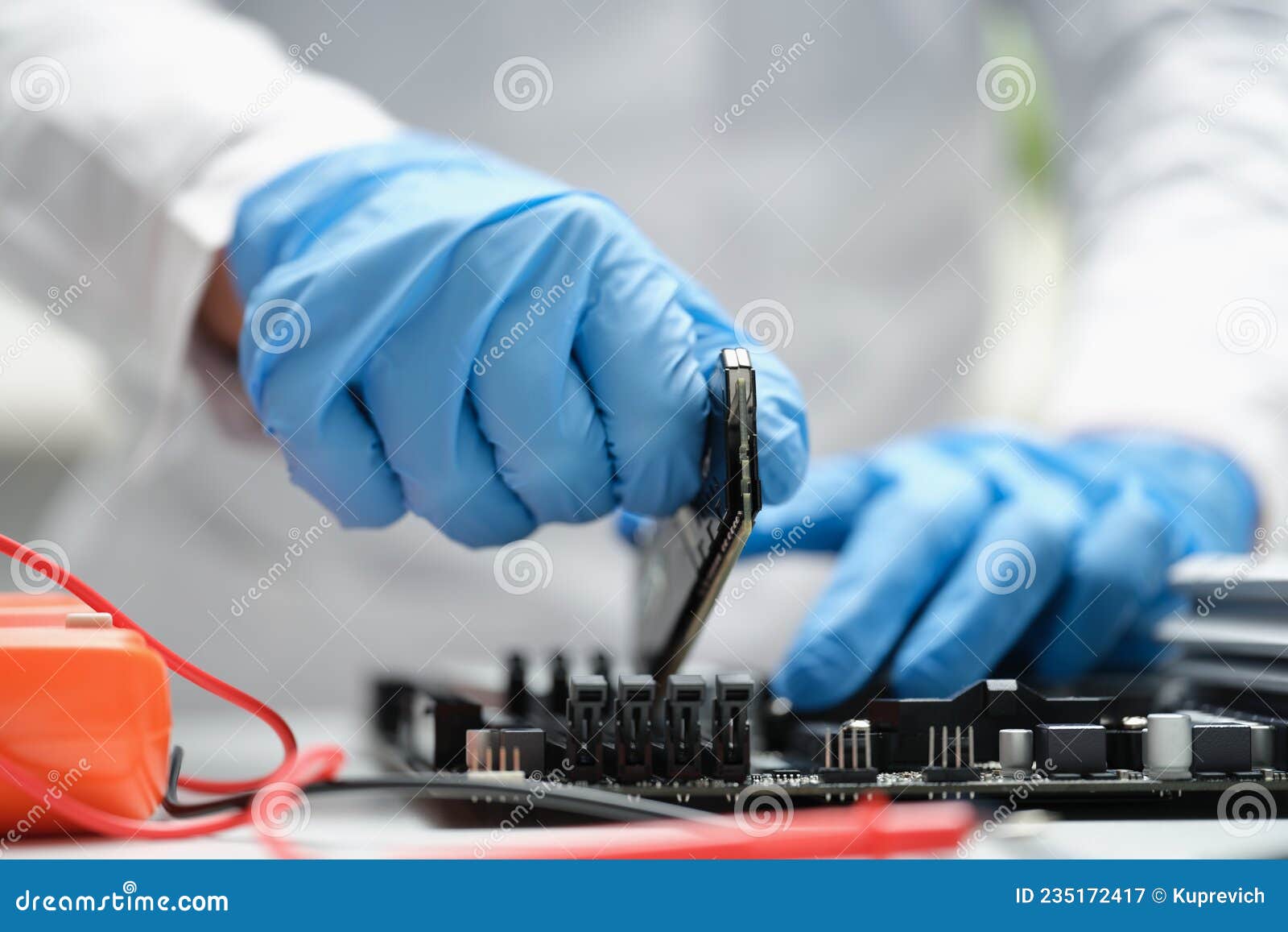A Man in Production Inserts a Microcircuit into a Device Stock Image ...