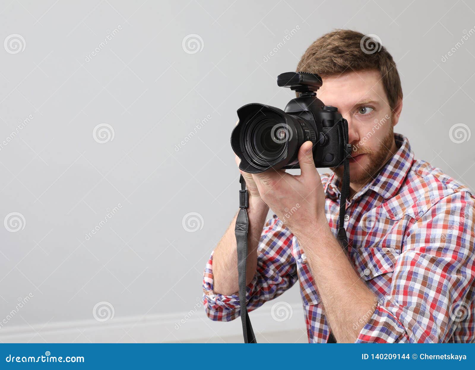 Man with Professional Camera in Photo Studio Stock Photo - Image of ...