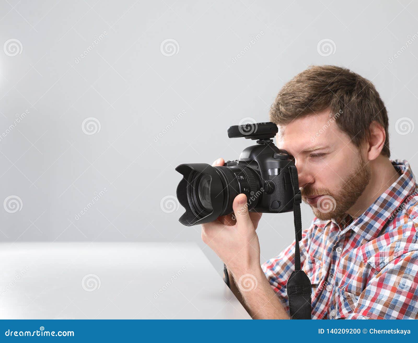 Man with Professional Camera in Photo Studio Stock Photo - Image of ...