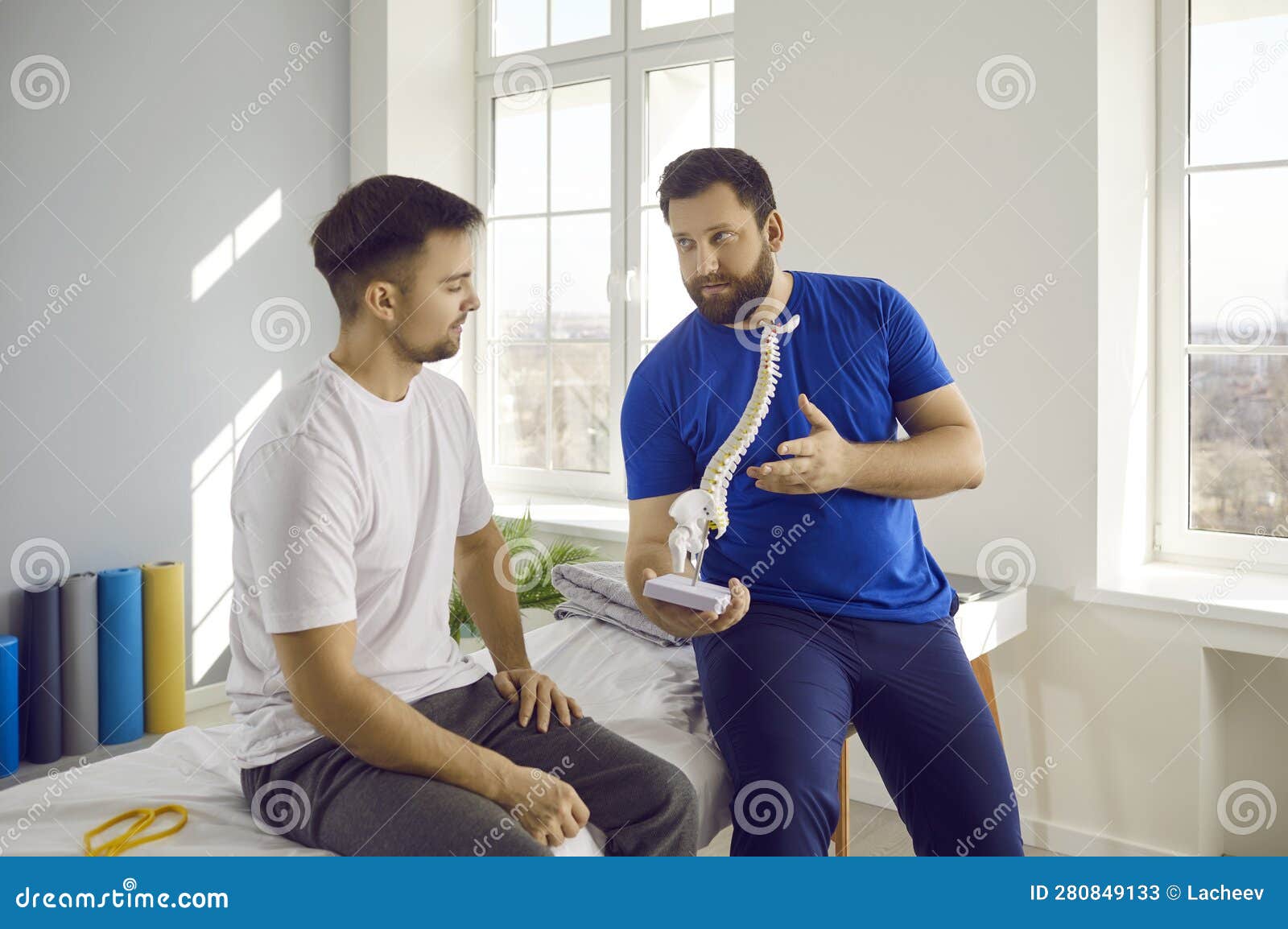 Man Professional Osteopath Chiropractor is Consulting Man Showing Him ...