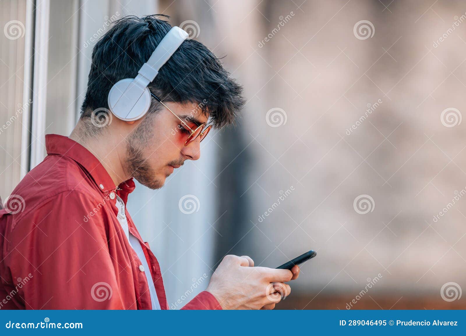 Man in Profile with Headphones and Mobile Phone Stock Image - Image of ...