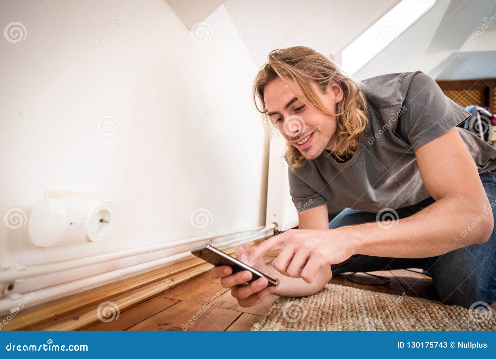 Man Programming a Power Outlet Using His Phone Stock Image - Image of ...