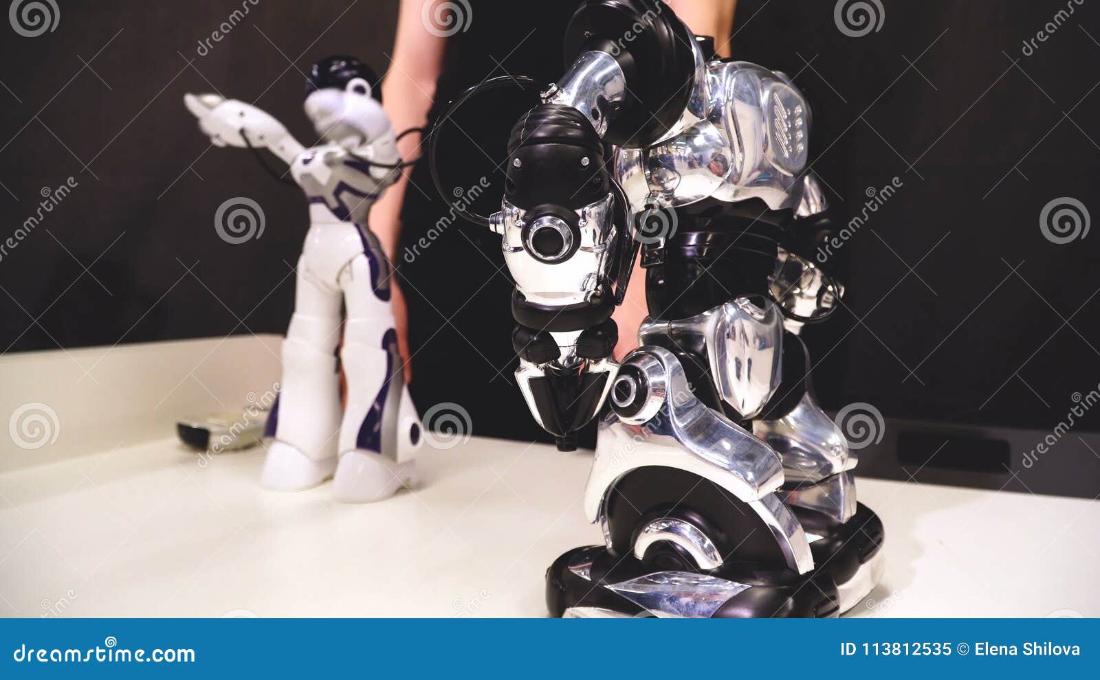 Man Programming Robots To Make Moves. Guy Control Operate Robots ...