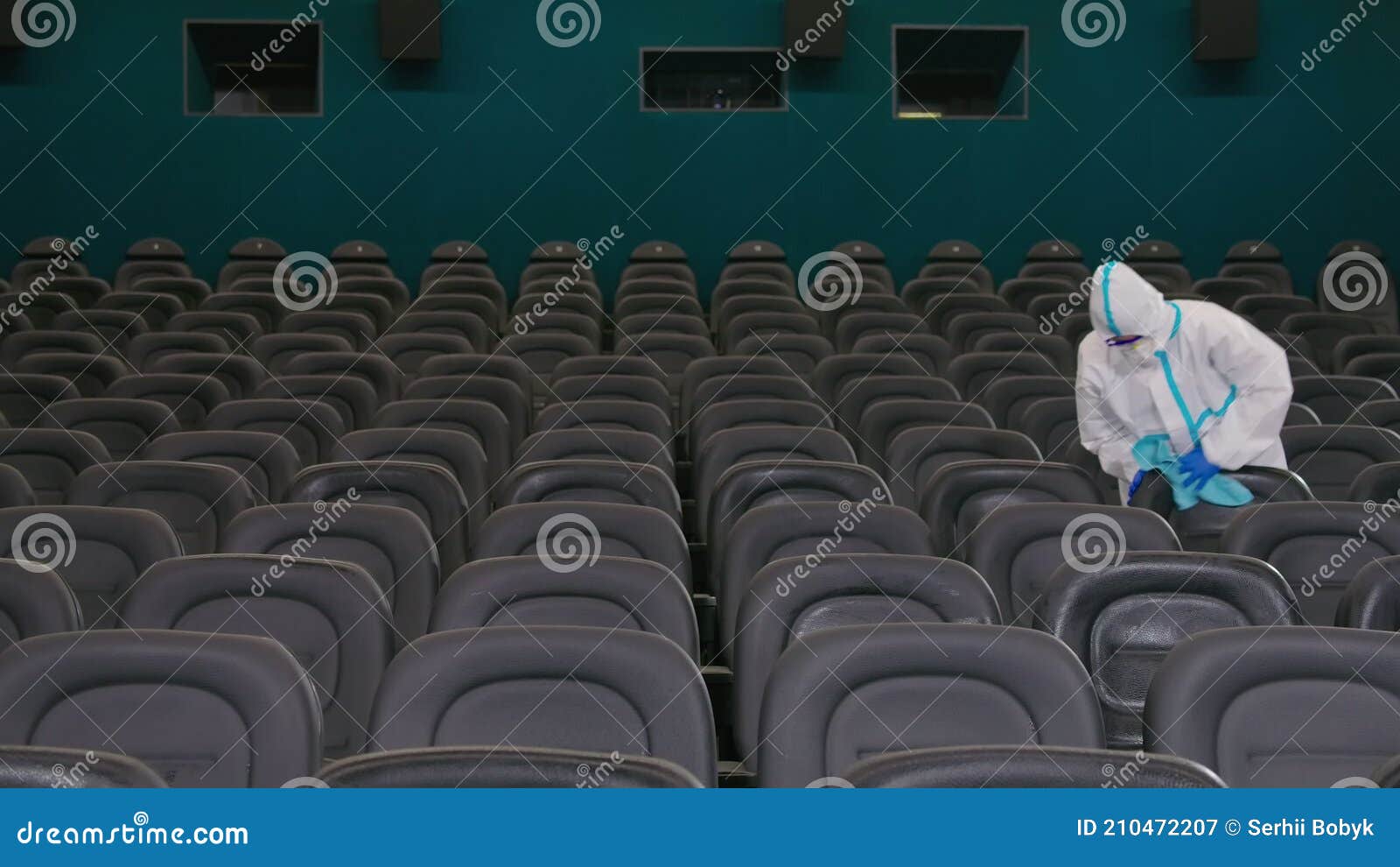 Worker Wiping Chairs with Disinfectants in Cinema. Stock Video - Video ...