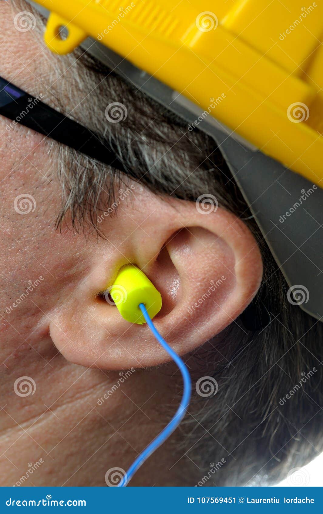 Man with Protective Ear Plugs Stock Image - Image of noise, hard: 107569451