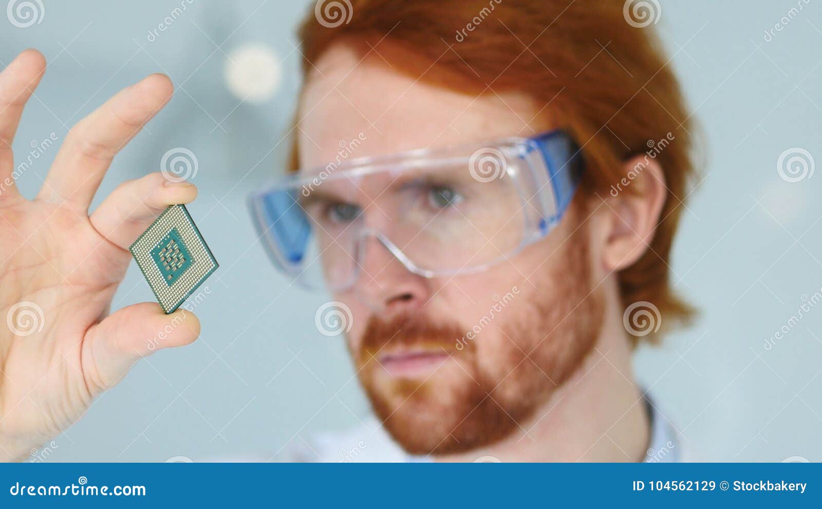 Man in Protective Glasses Looking at Computer Chip Stock Image - Image ...