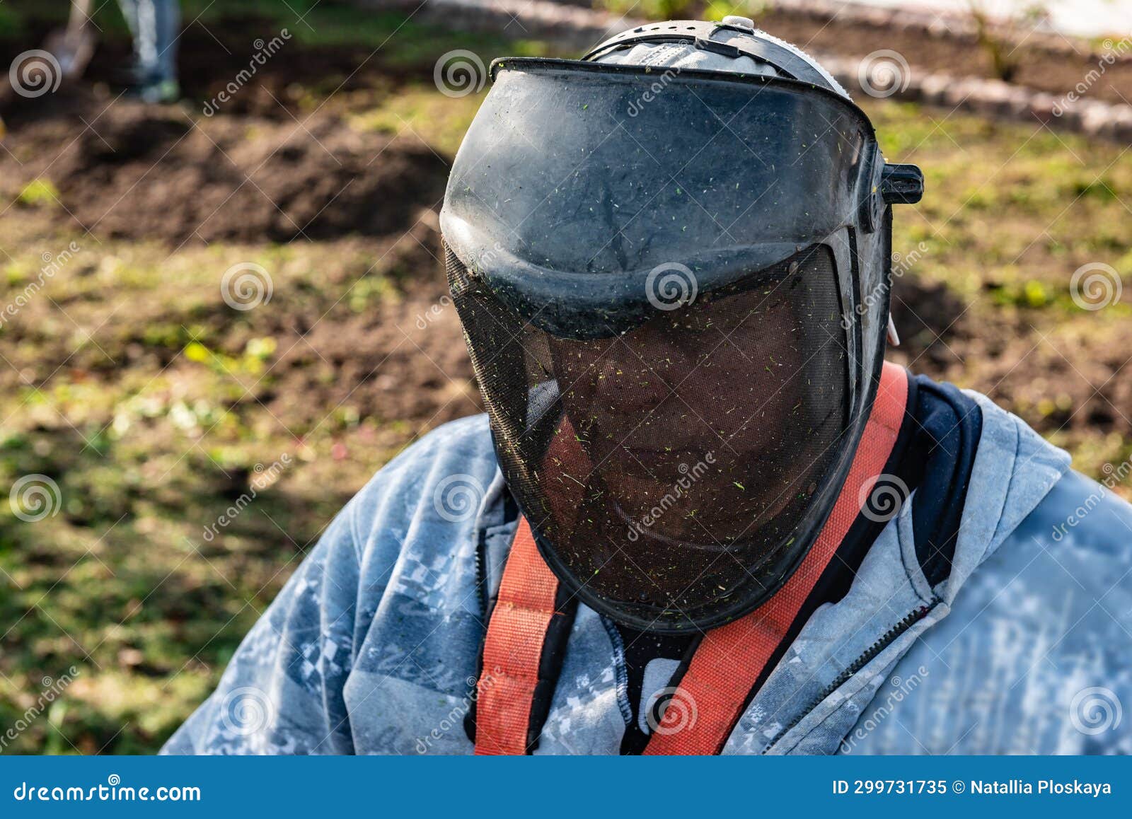 Man in Protective Mask for Mowing Grass with a Lawn Mower. Stock Image ...