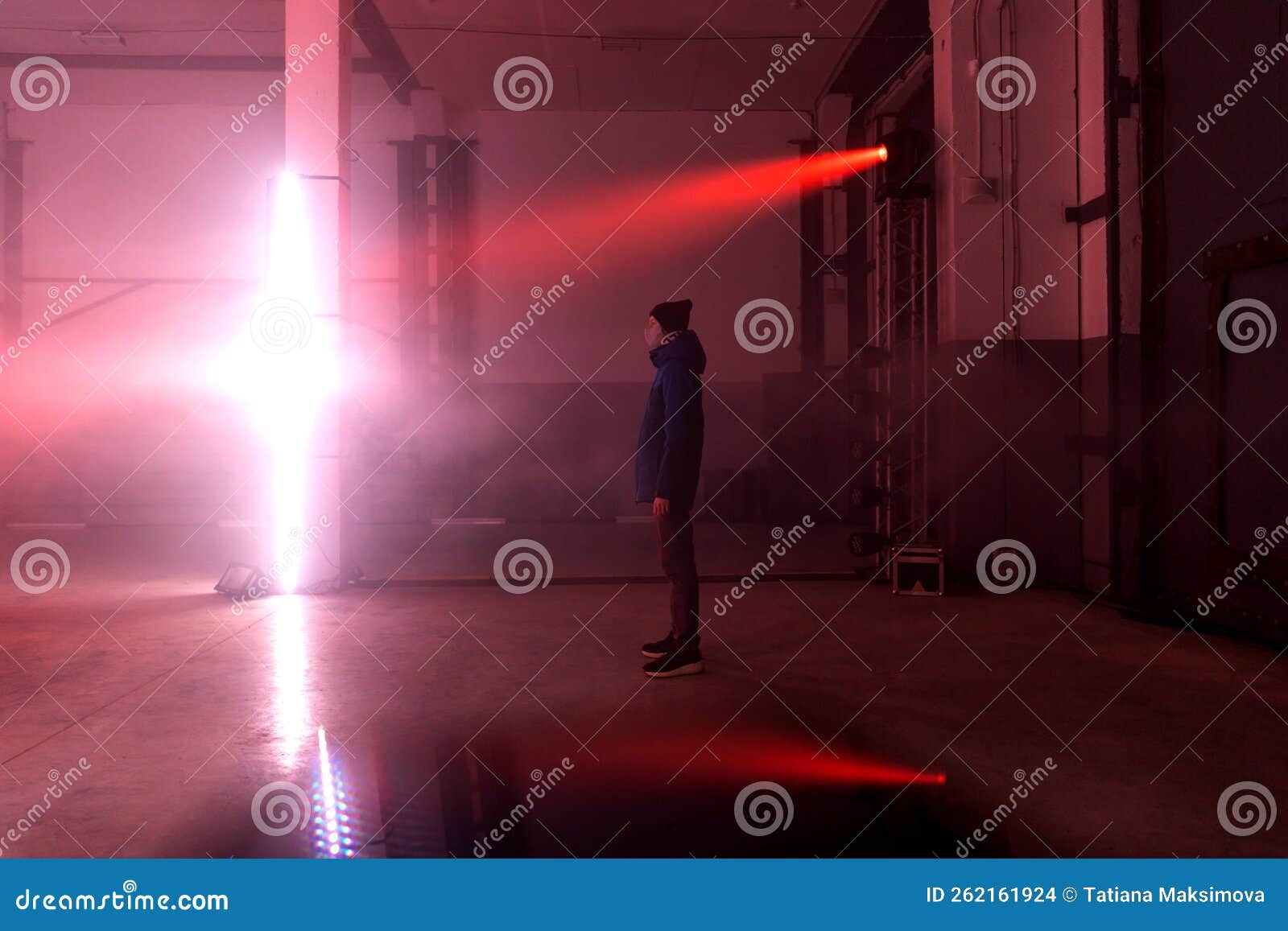 Man in Protective Mask Stand in Neon Light Garage. Stock Photo - Image ...
