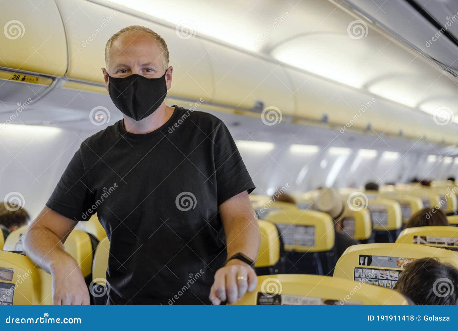 Man in Protective Mask Standing in the Airplane Stock Photo - Image of ...