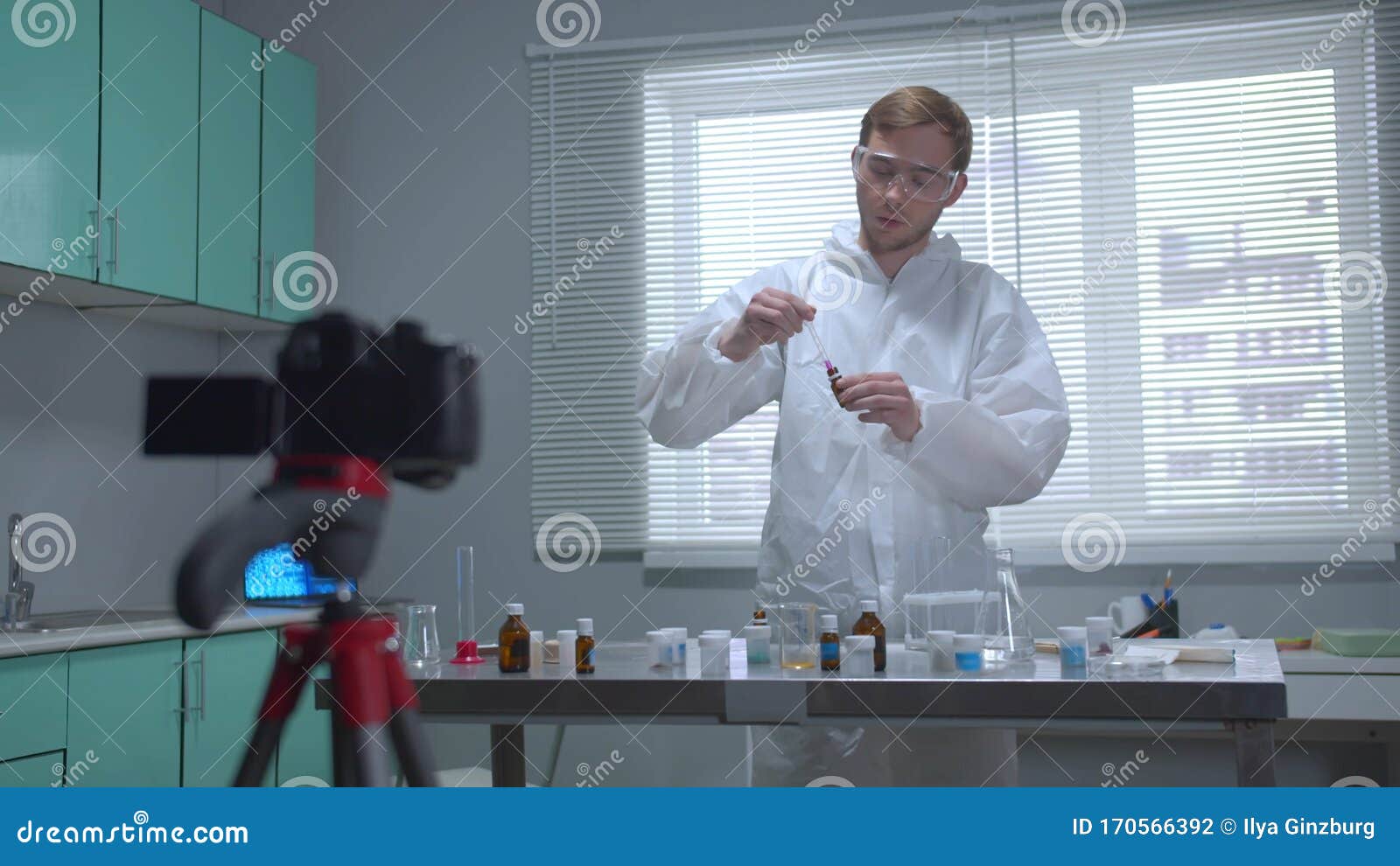 Man in Protective Workwear Show His Work on Camera in the Laboratory ...