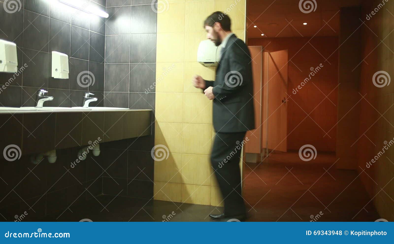 Man in a public restroom stock footage. Video of mirror - 69343948