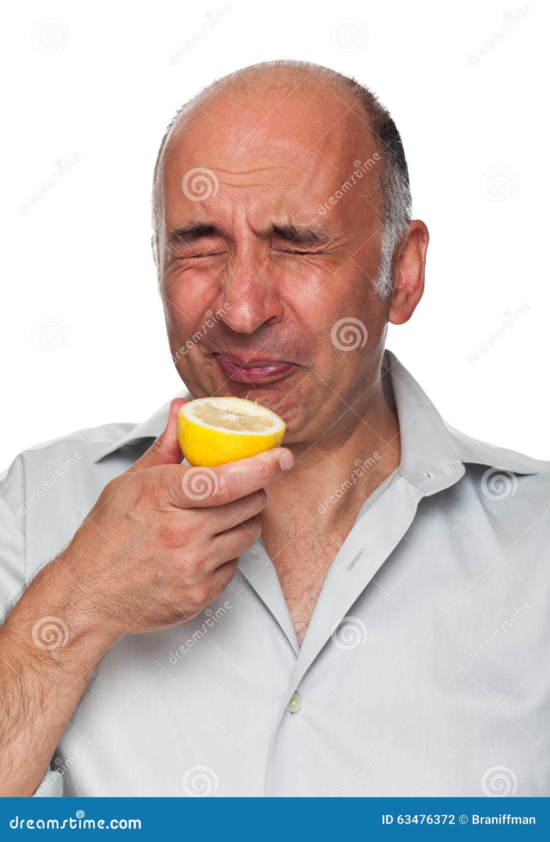 Man Puckers after Eating a Lemon Stock Photo - Image of crossed, humor ...