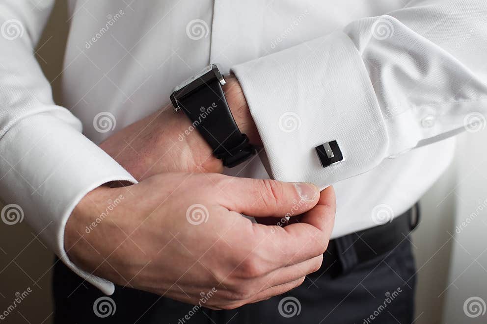 Man adjusting sleeve cuff stock photo. Image of adjust - 29915422